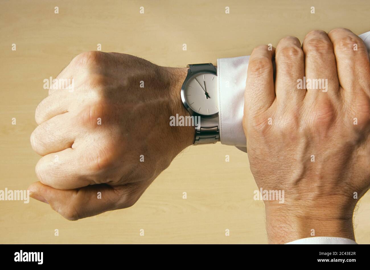 You look at the clock - sense of time - punctuality Stock Photo - Alamy