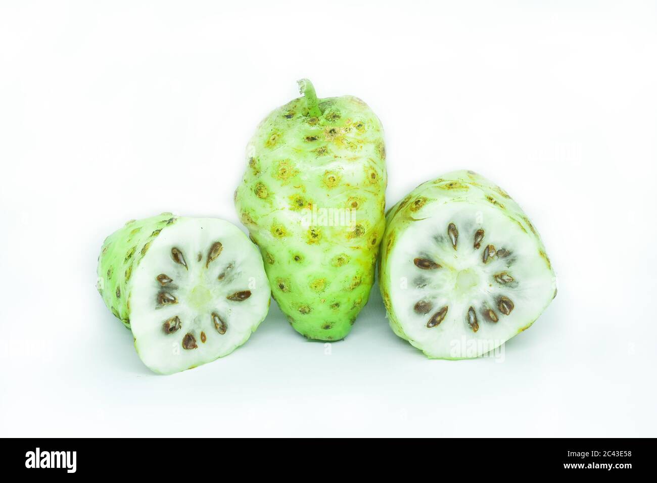 noni or Morinda Citrifolia and slice isolated on white background Stock ...