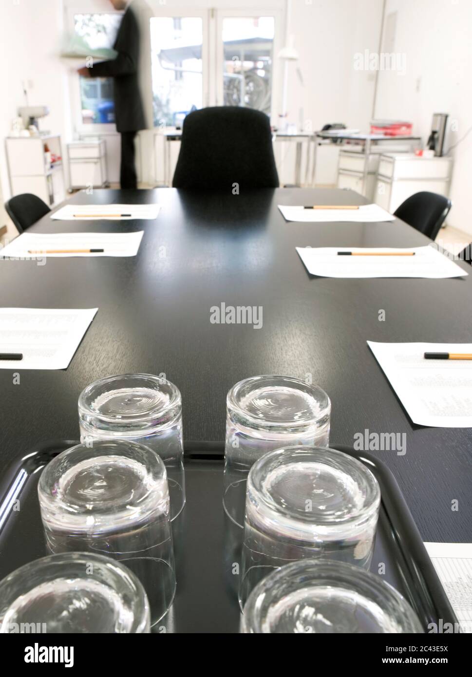 Pens on documents on the seats of a conference table - preparation ...
