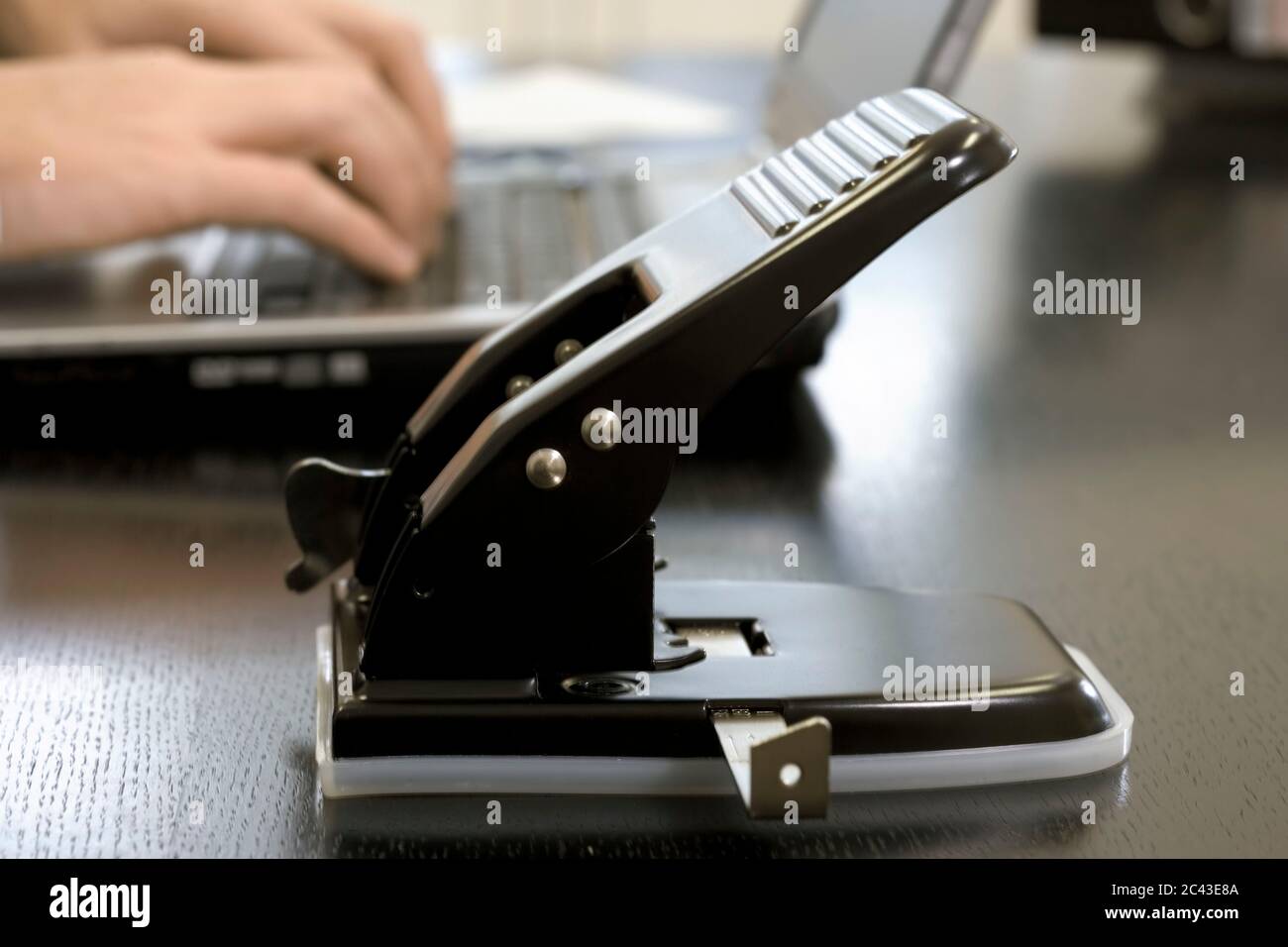 Punch on a desk - office work Stock Photo - Alamy