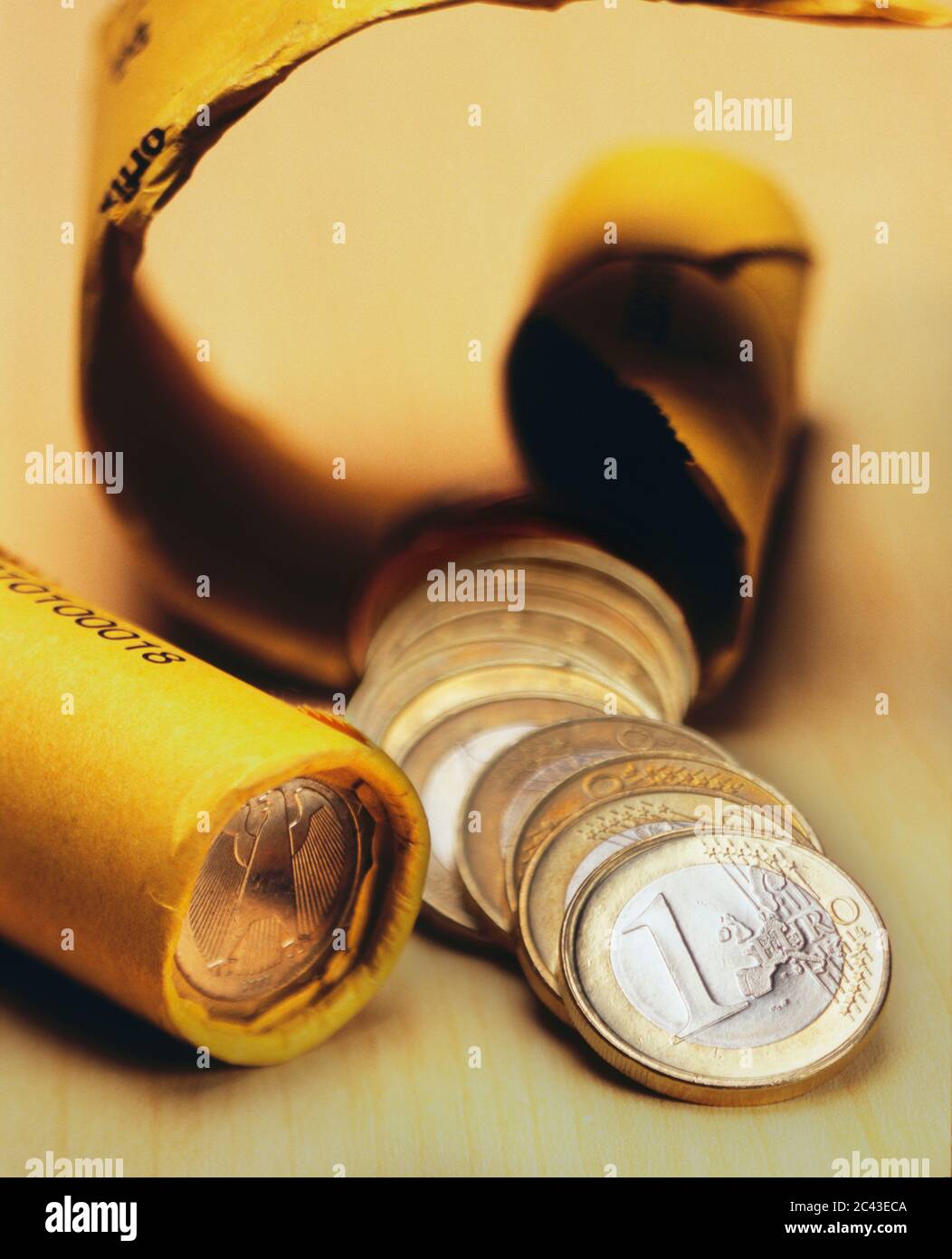 One euro coins in a roll - money Stock Photo - Alamy