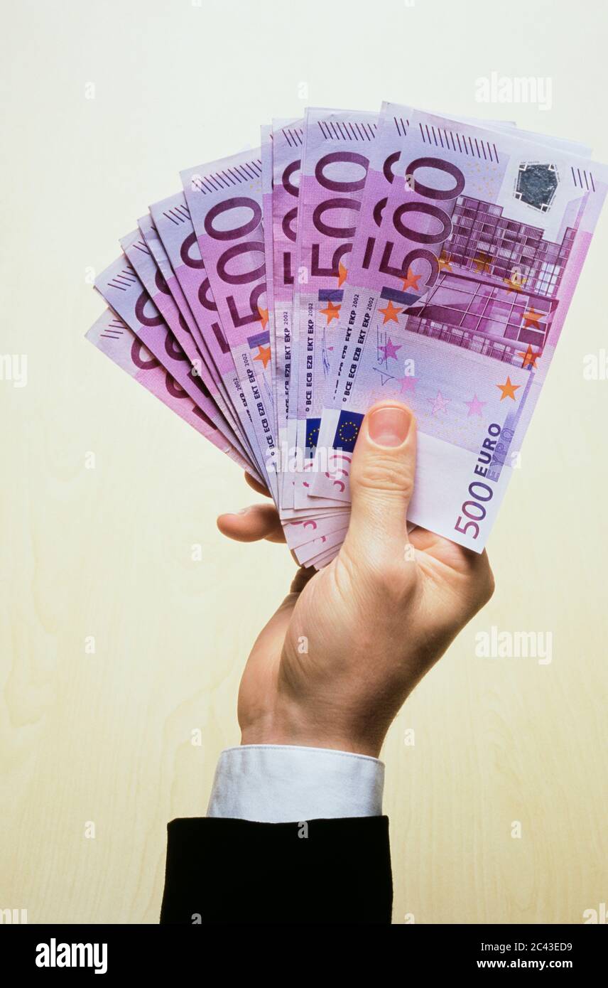 Hand holds 50 euro notes - wealth - savings Stock Photo - Alamy