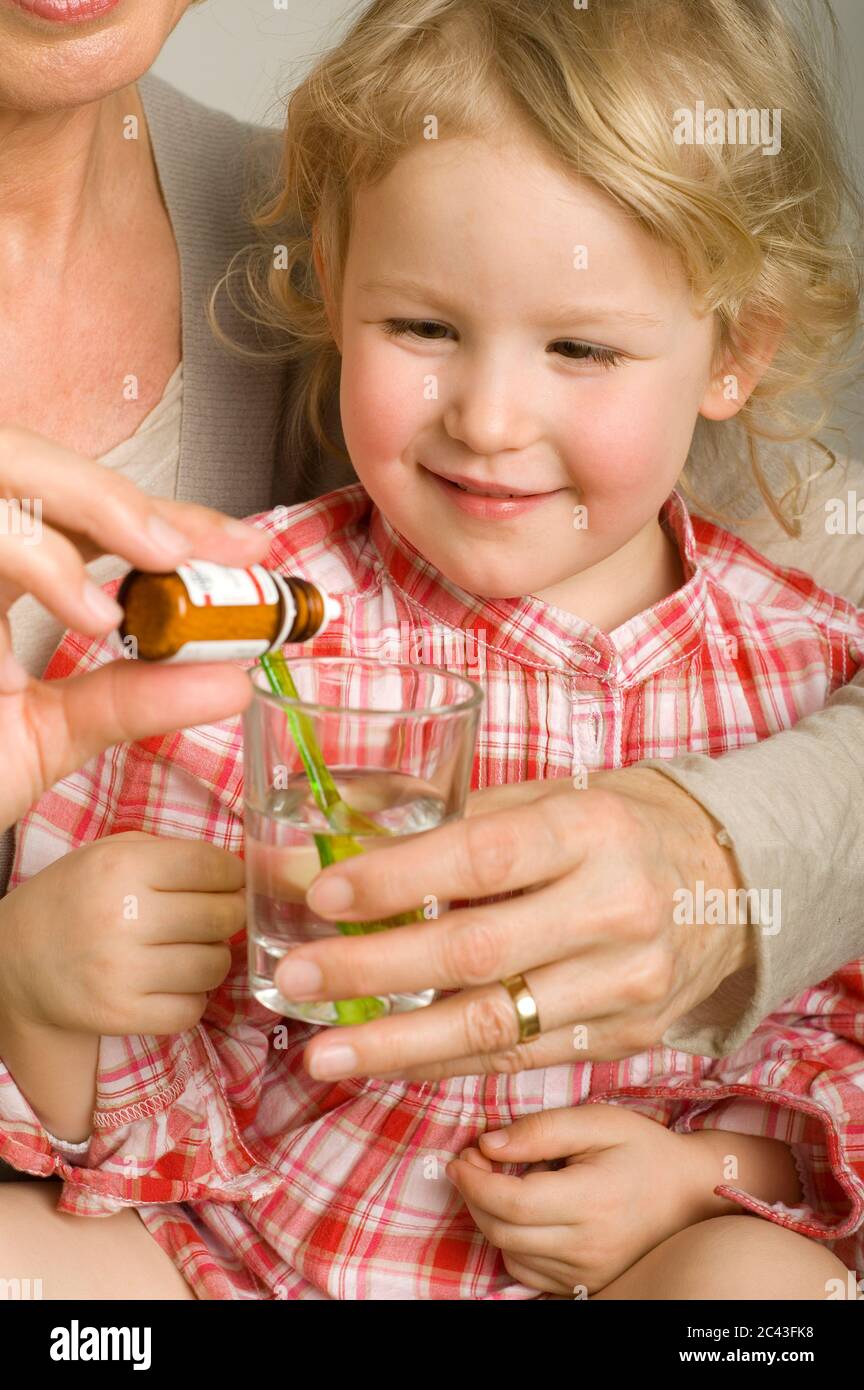 Infant is given medication Stock Photo - Alamy