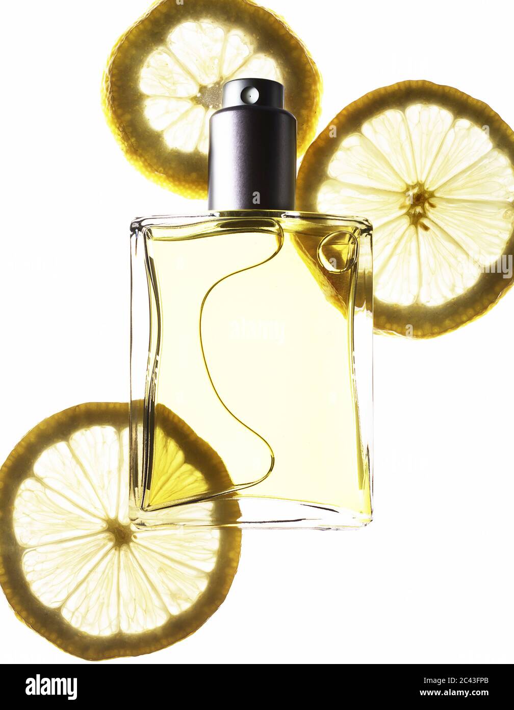 Perfume bottle and lemon slices Stock Photo - Alamy