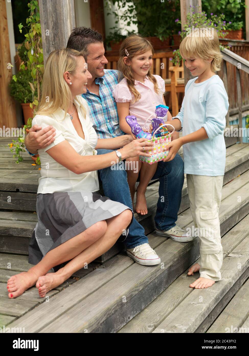 Happy family with Easter basket, Munich, Bavaria, Germany Stock Photo ...