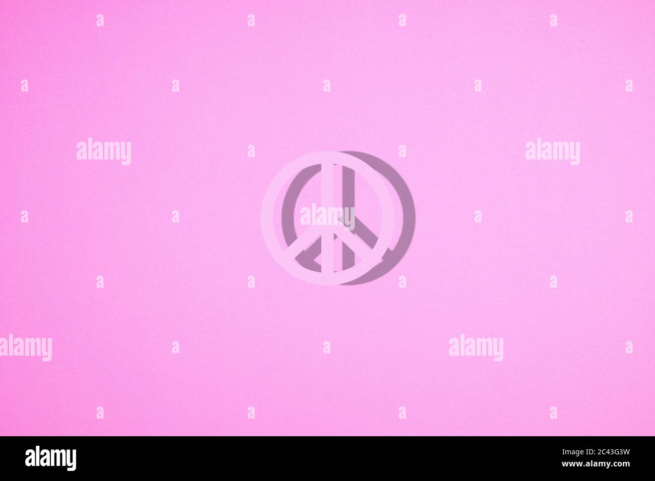 a peace symbol made by cutting paper. Minimal concept art Stock Photo ...