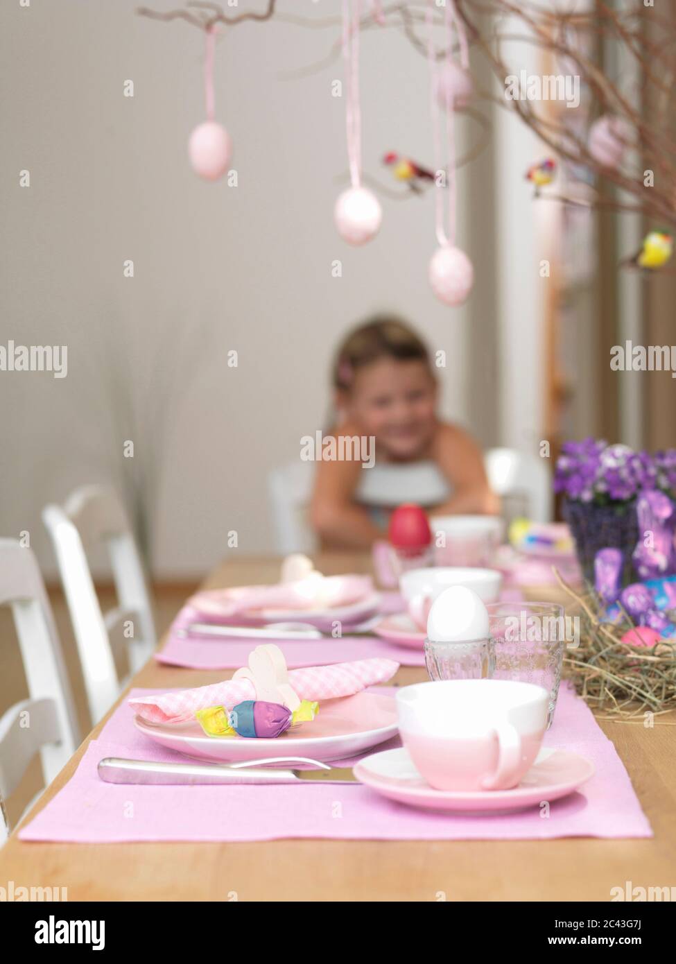 Laid Easter table with girl in the background, Munich, Bavaria, Germany ...