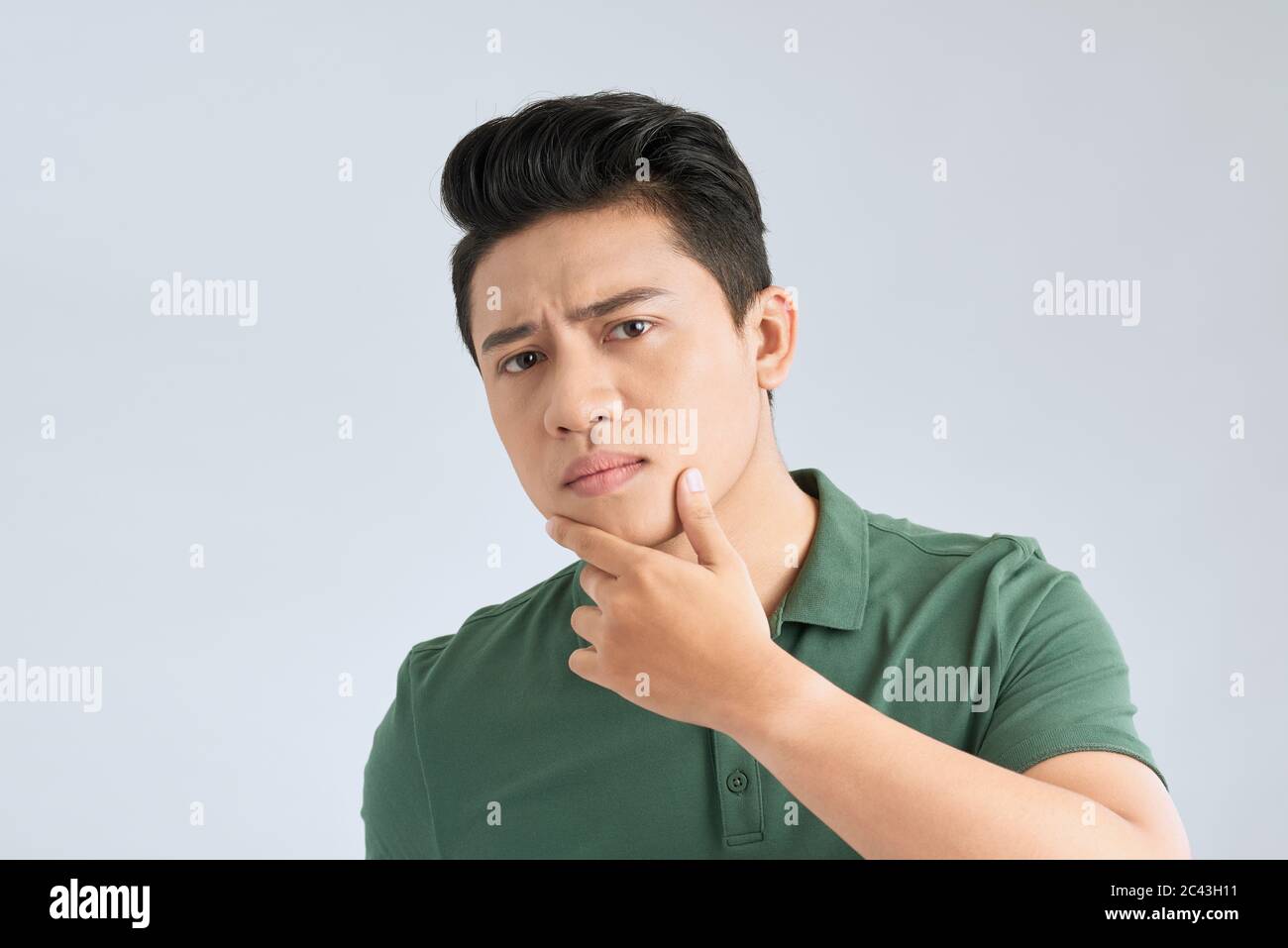 man checking his face in the mirror Stock Photo - Alamy