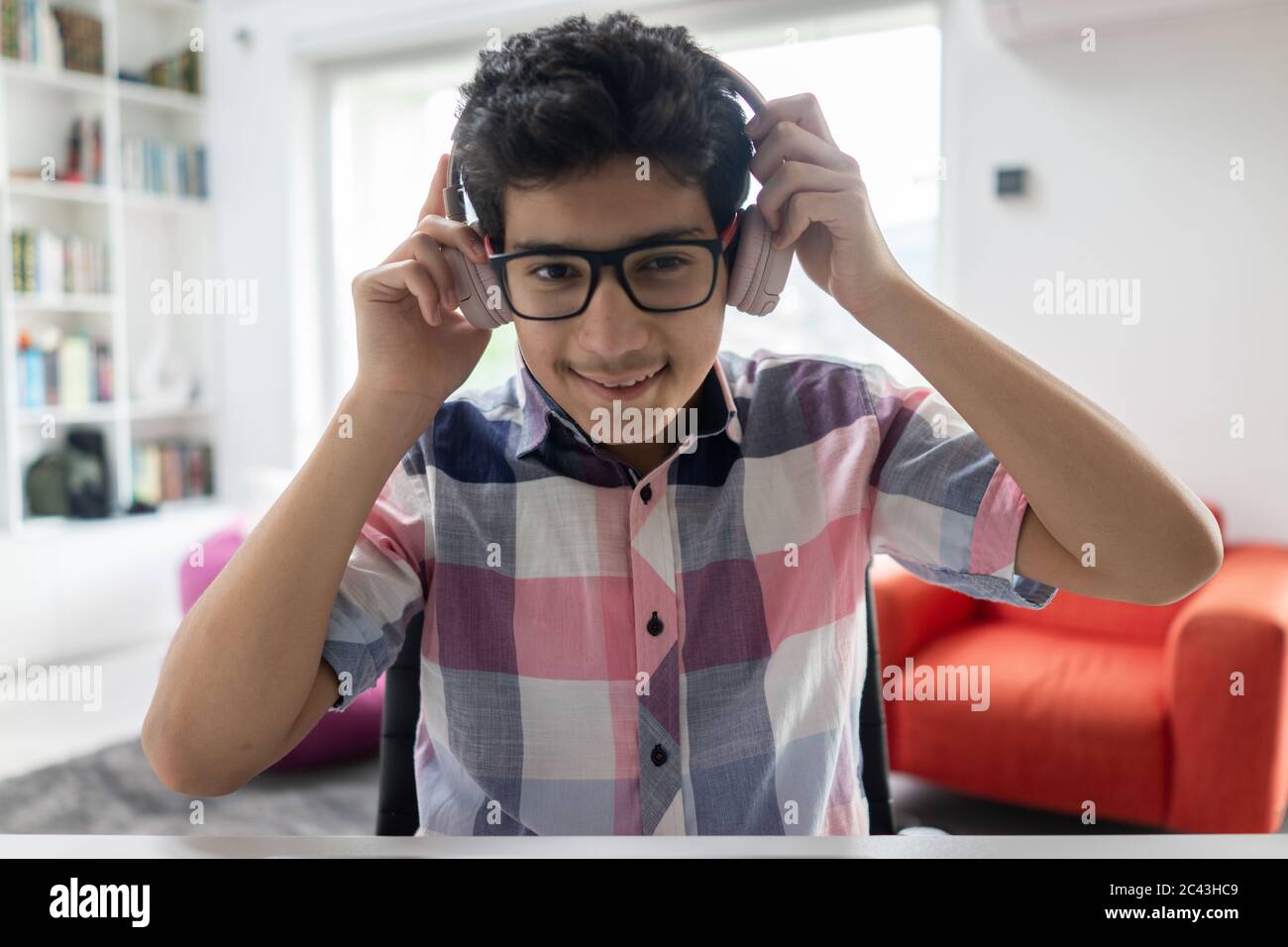 Teenage boy having online class Stock Photo - Alamy