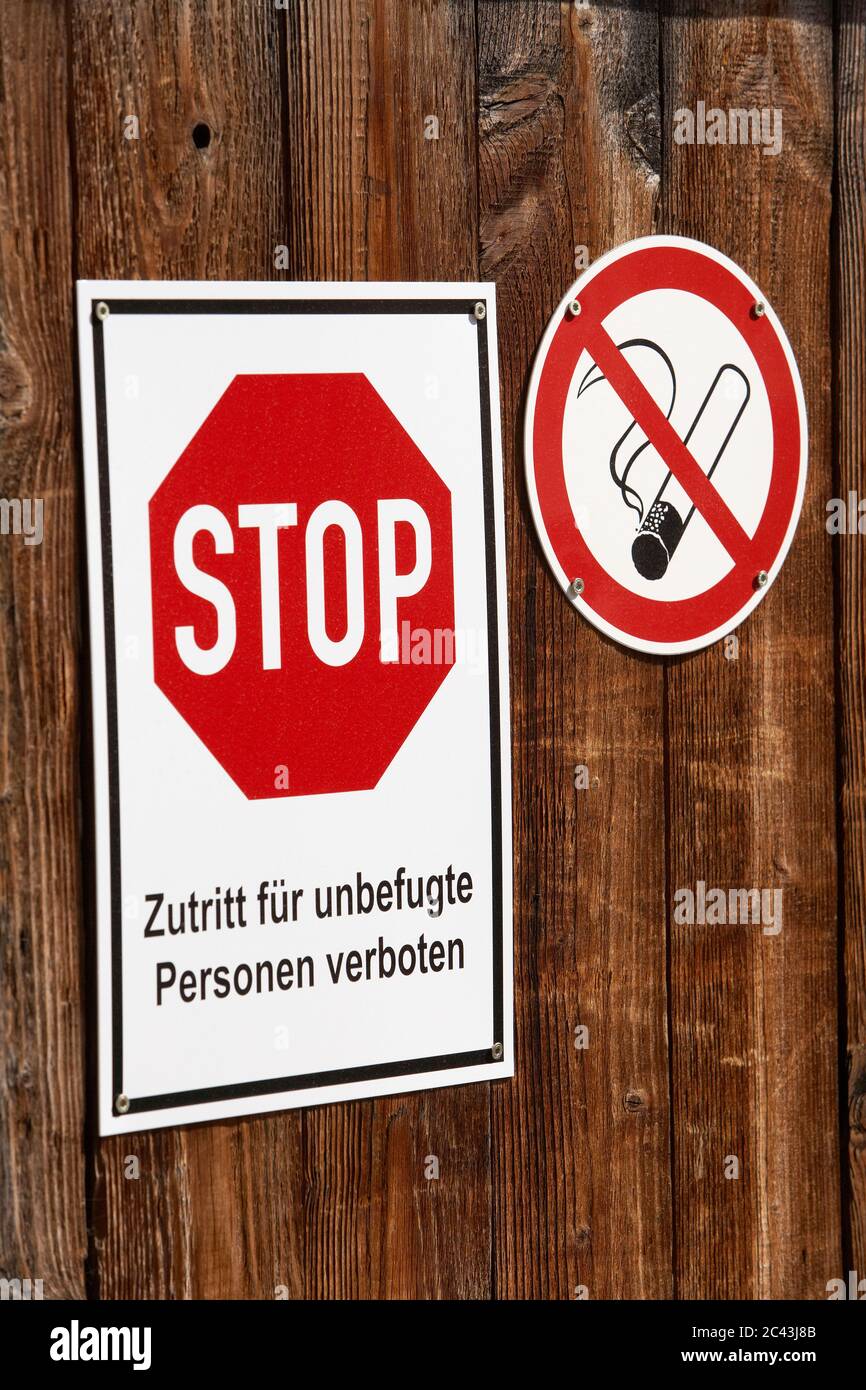 Stop sign and no smoking sign on a wooden fence, Engen, Baden ...