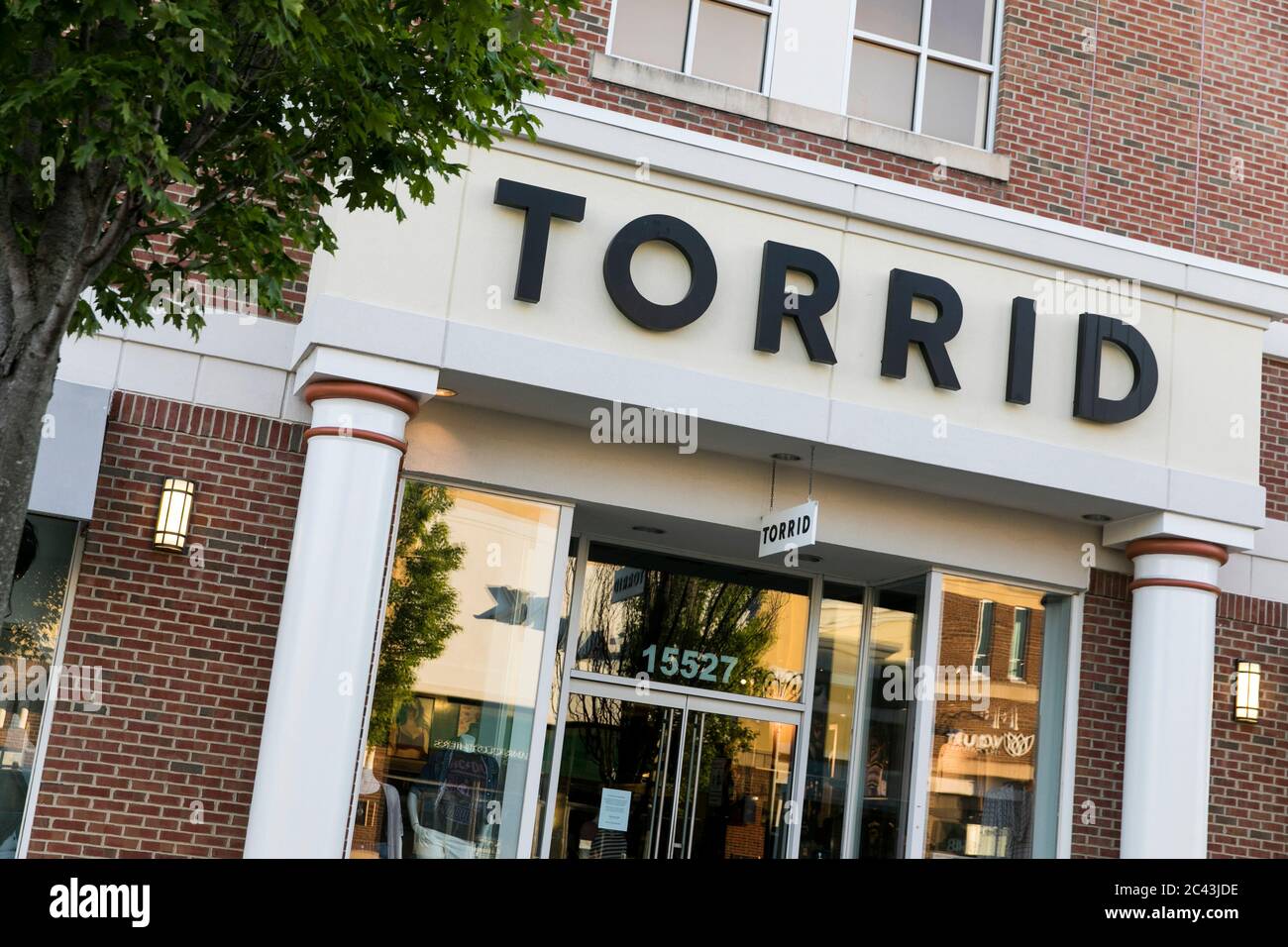 A logo sign outside of a Torrid retail store location in Bowie ...