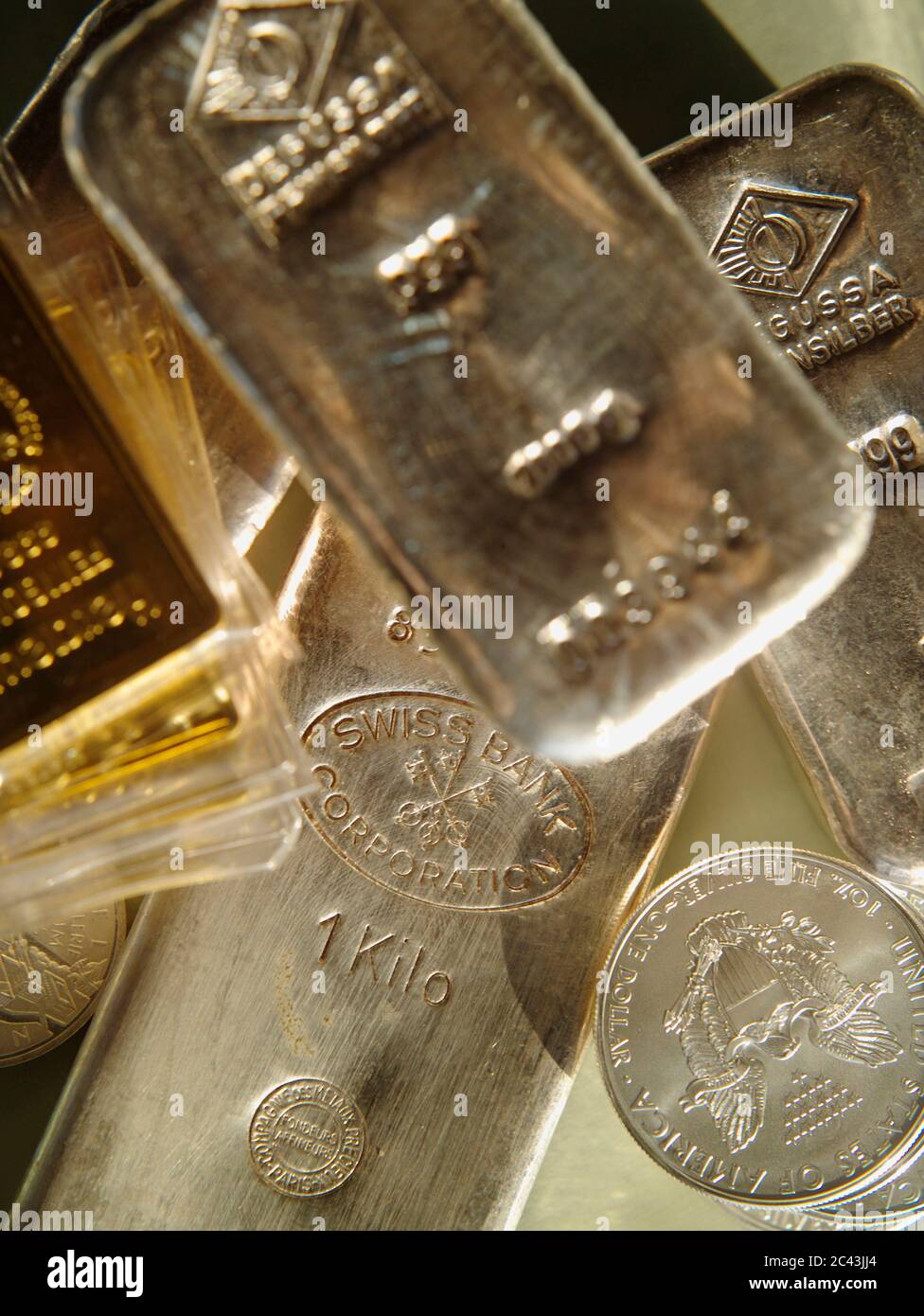 Silver bars and coins Stock Photo - Alamy