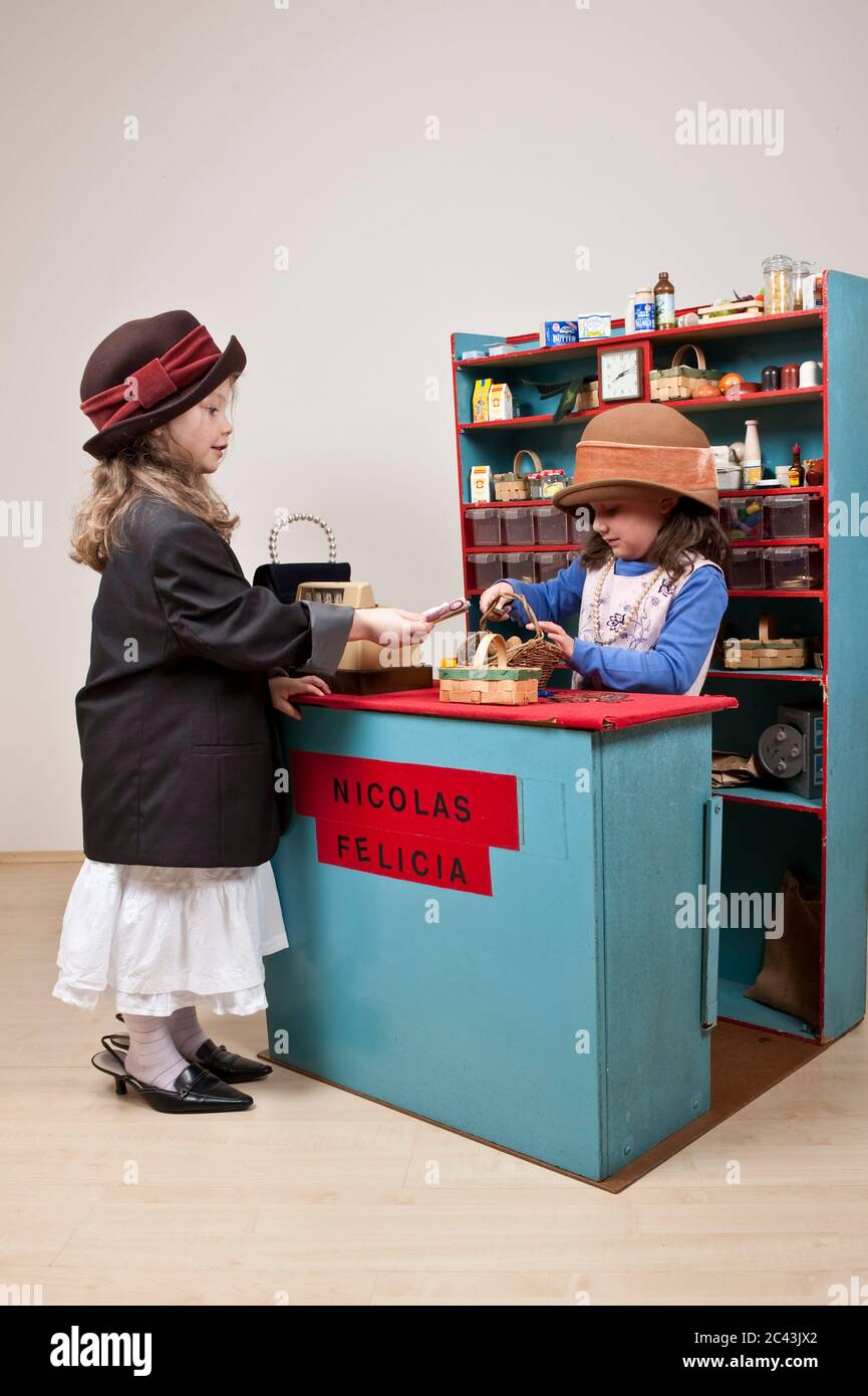 Two girls in the grocery store Stock Photo - Alamy