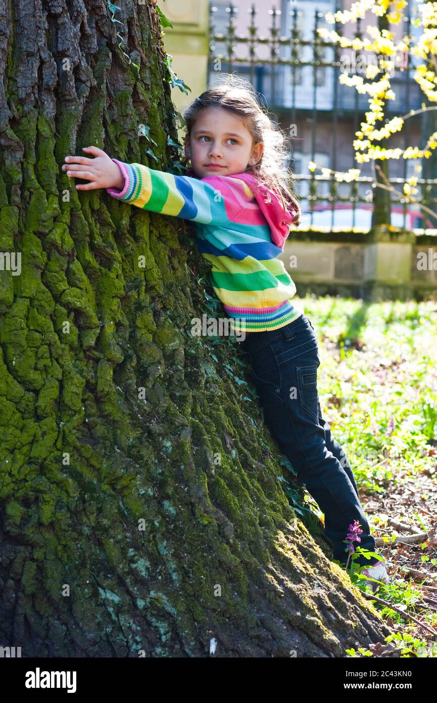 Children tree hugs hi-res stock photography and images - Alamy