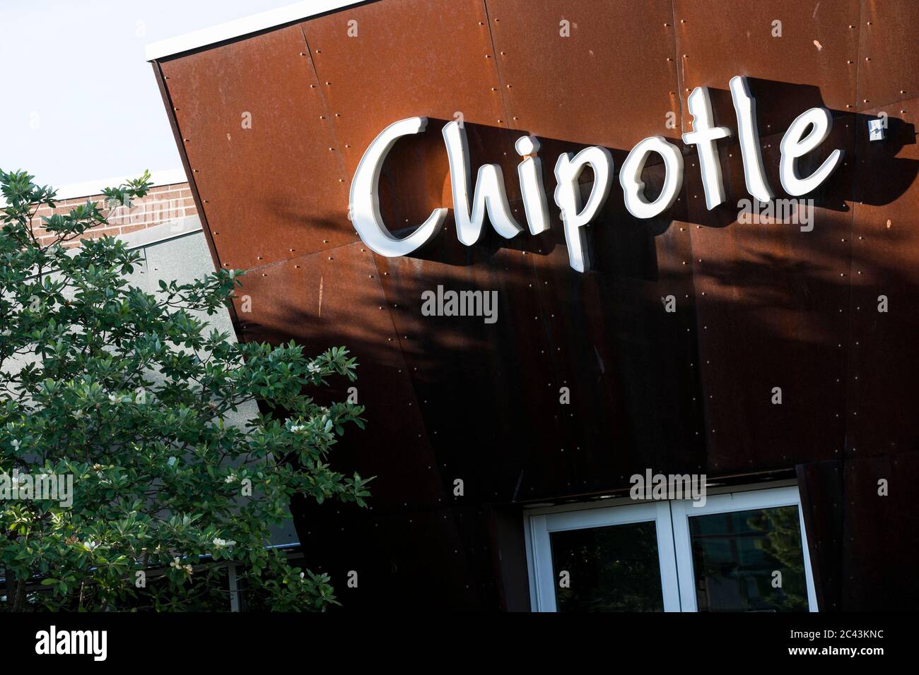 A logo sign outside of a Chipotle restaurant location in Bowie ...
