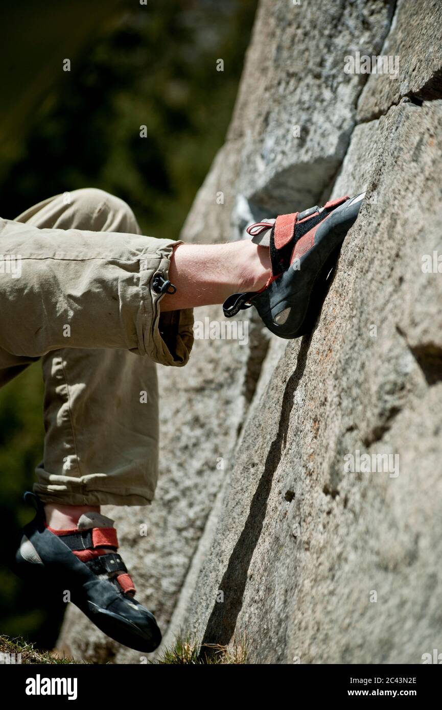 Man climbing up rocks hi-res stock photography and images - Alamy