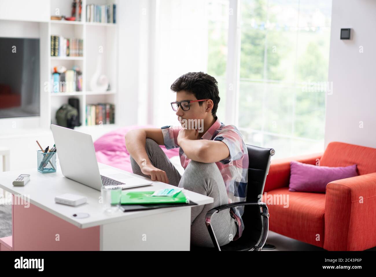 Teenage boy having online class Stock Photo - Alamy