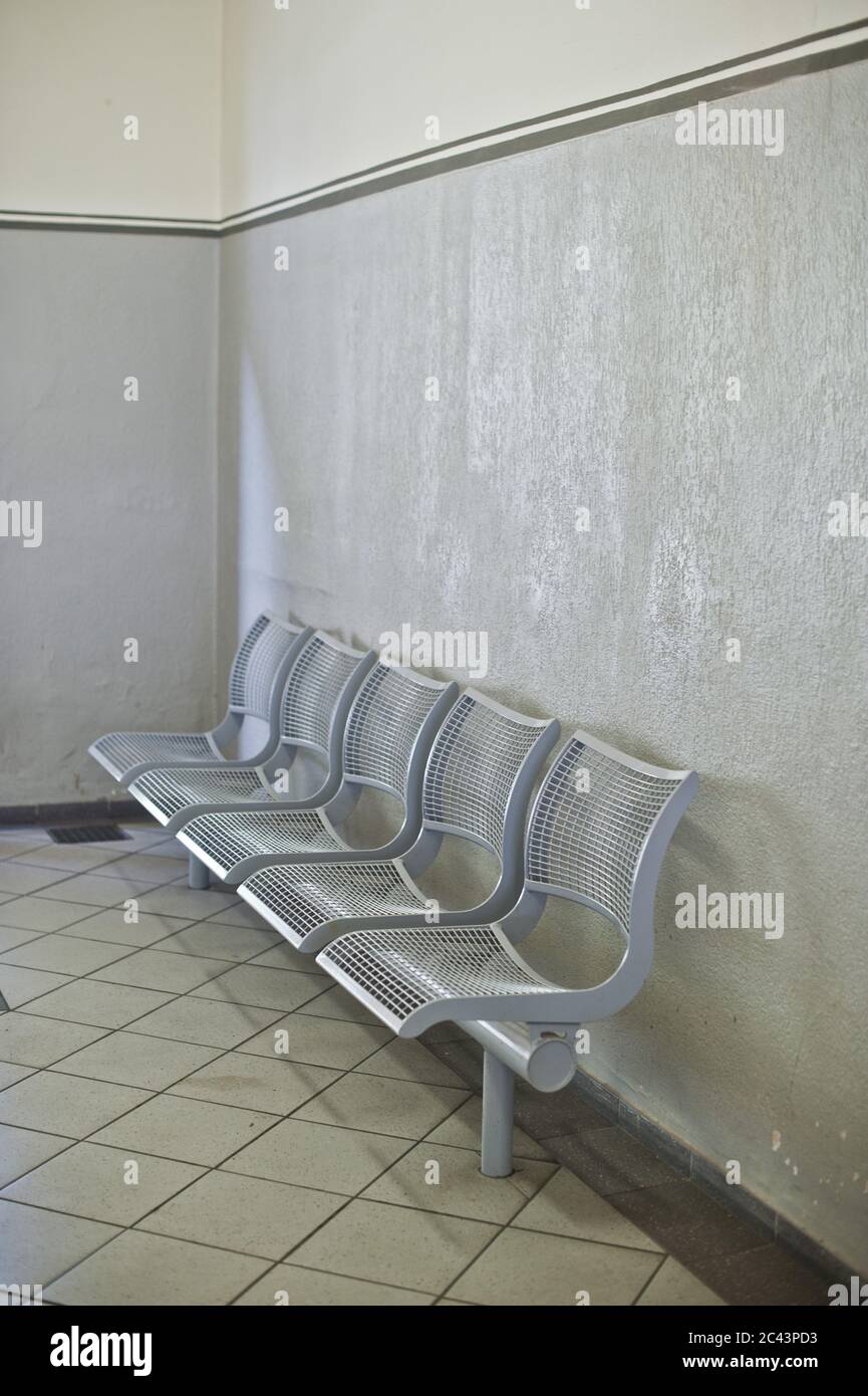 Empty chairs in a station concourse Stock Photo - Alamy