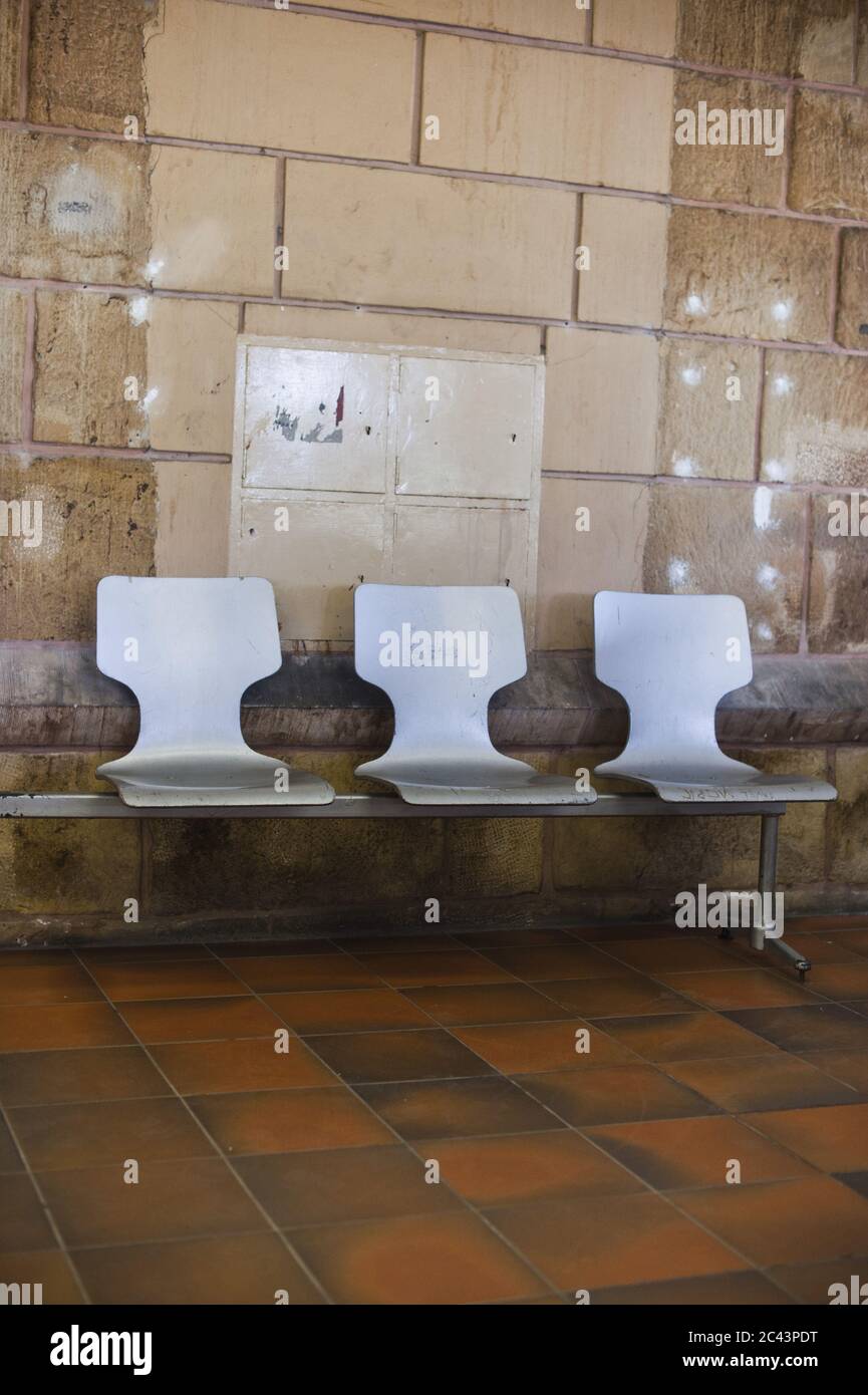 Empty chairs in a station concourse Stock Photo - Alamy