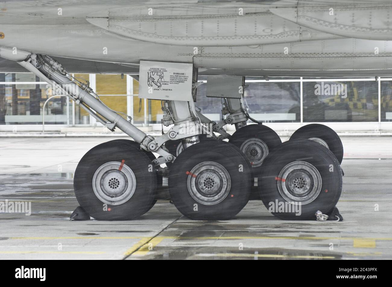 Wheels of an airplane on the runway Stock Photo - Alamy