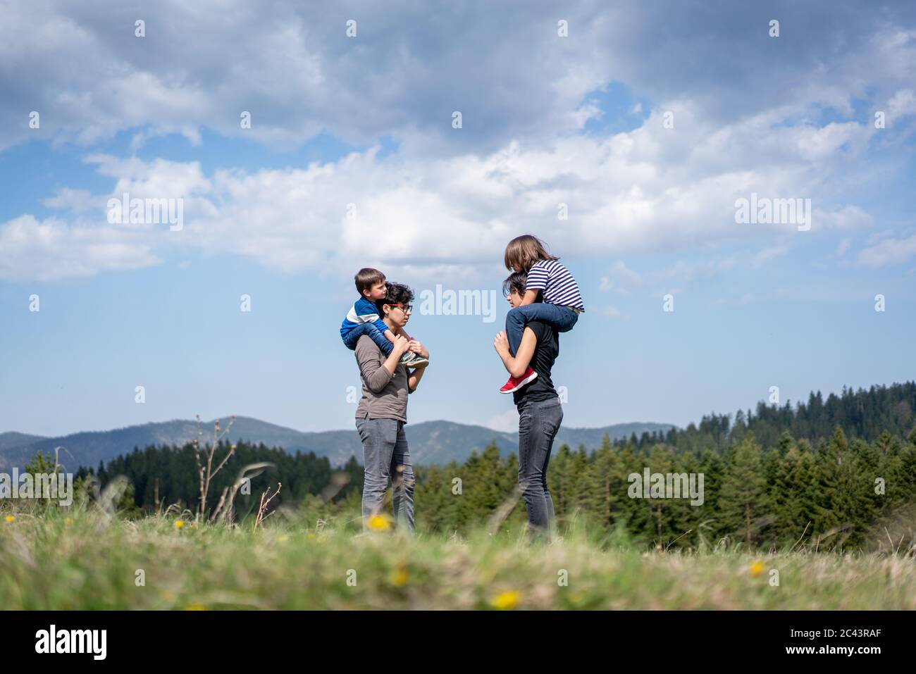 Big brother holding little brothers hi-res stock photography and images ...