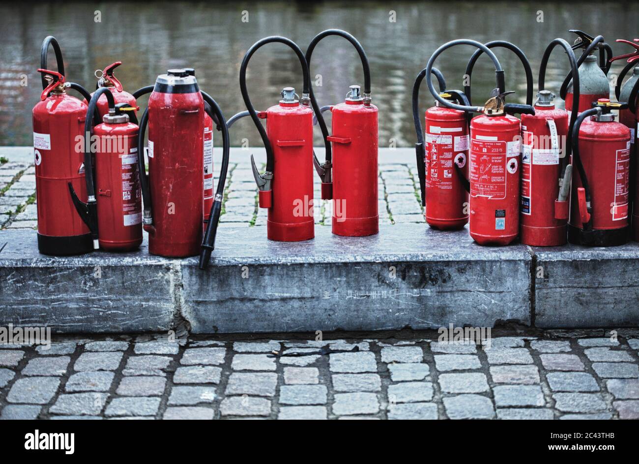 Group of fire extinguishers on the roadside Stock Photo - Alamy