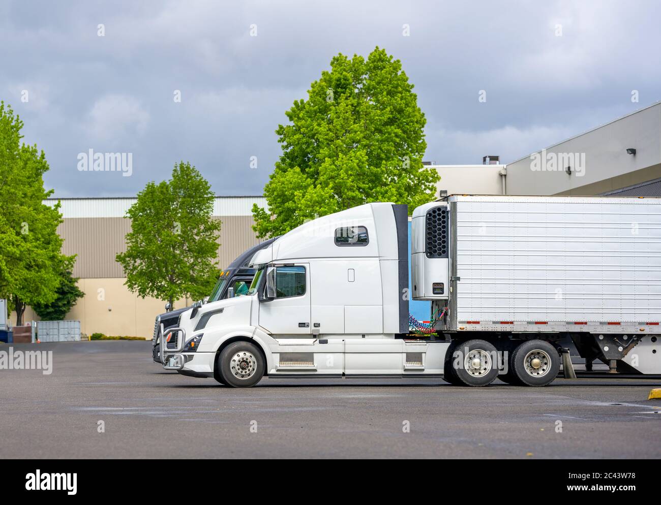 Big rig long haul industrial freight white semi truck loading ...