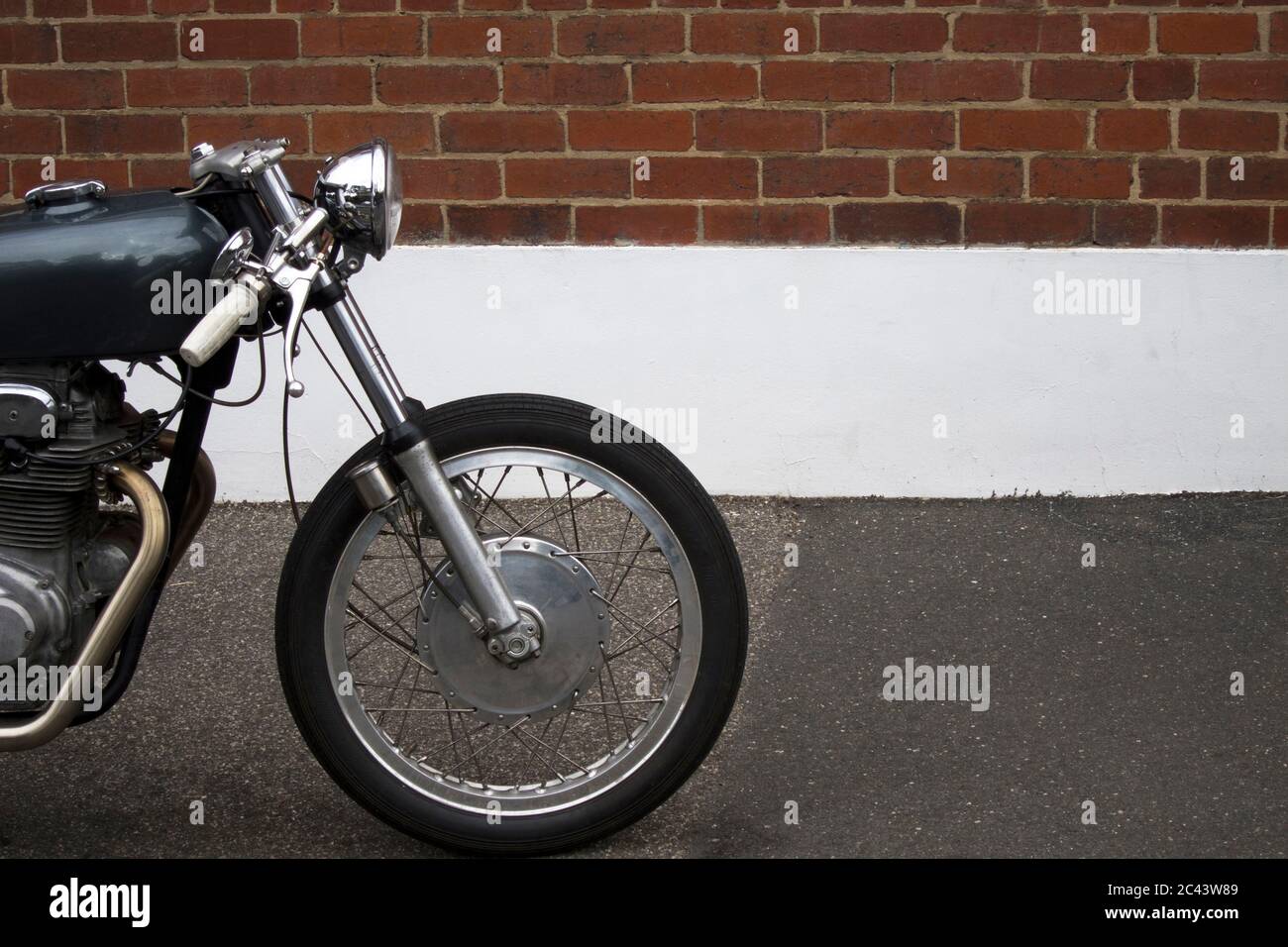 Motorbike in front of a brick wall Stock Photo - Alamy