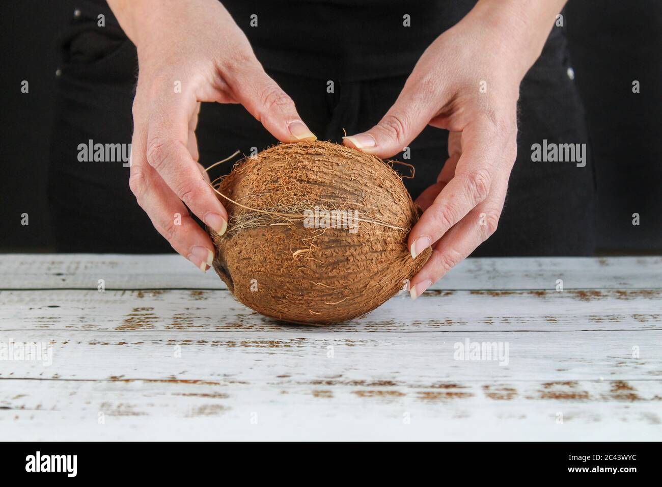 Cocunut shell on white table and back background Stock Photo - Alamy