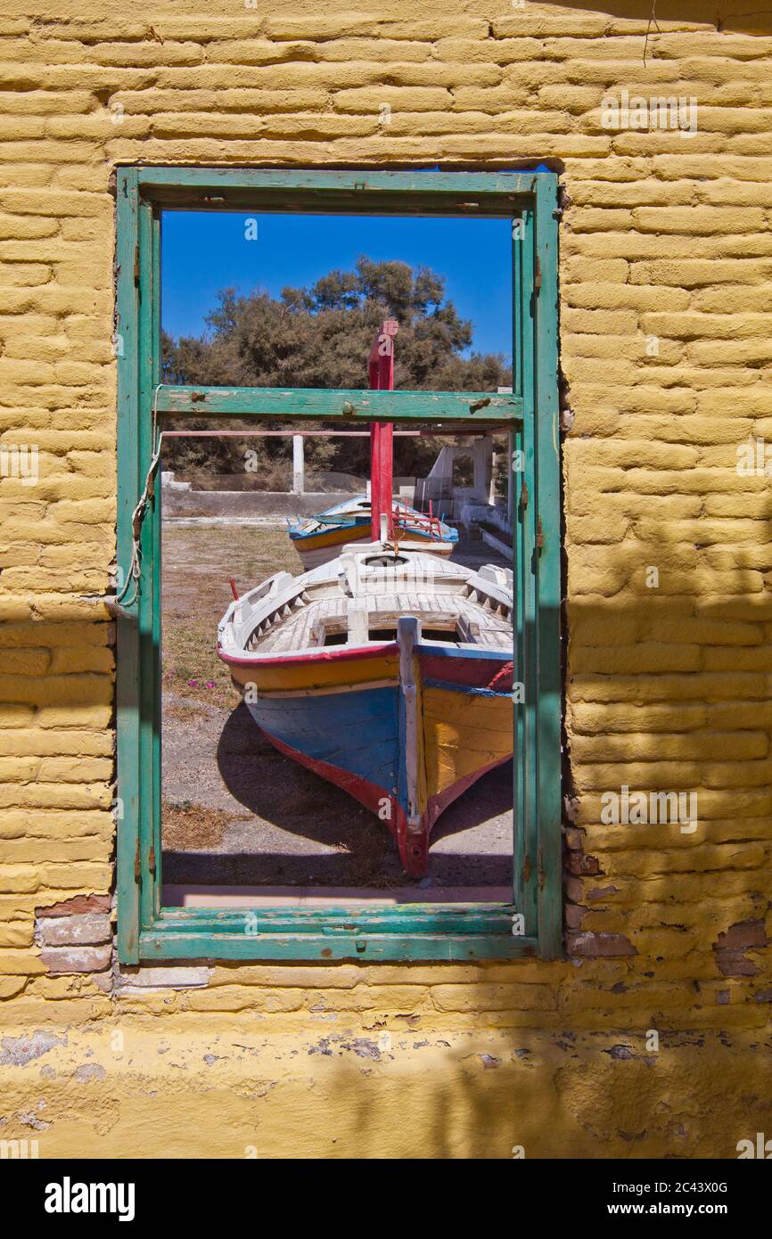 Fishing boat behind a window, Santorini, Greece Stock Photo - Alamy