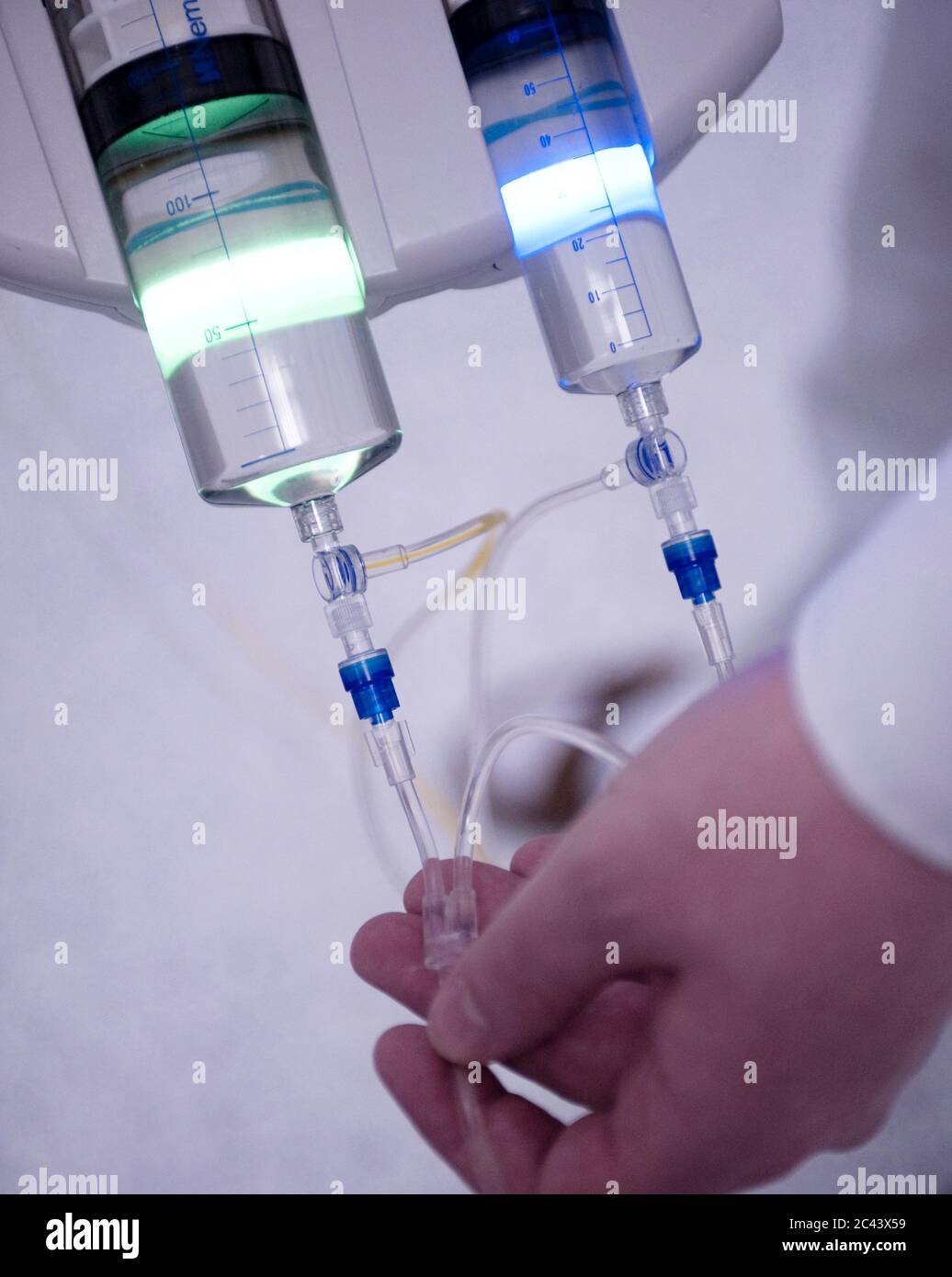 Hand adjusts an infusion Stock Photo - Alamy