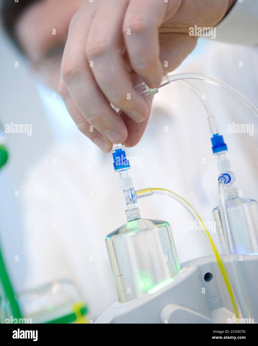 Hand adjusts an infusion Stock Photo - Alamy