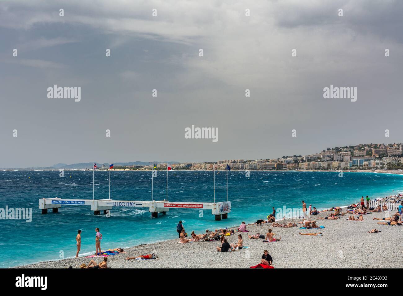 Nice, France - June 14, 2019 : Tourists enjoying their day on the beach ...