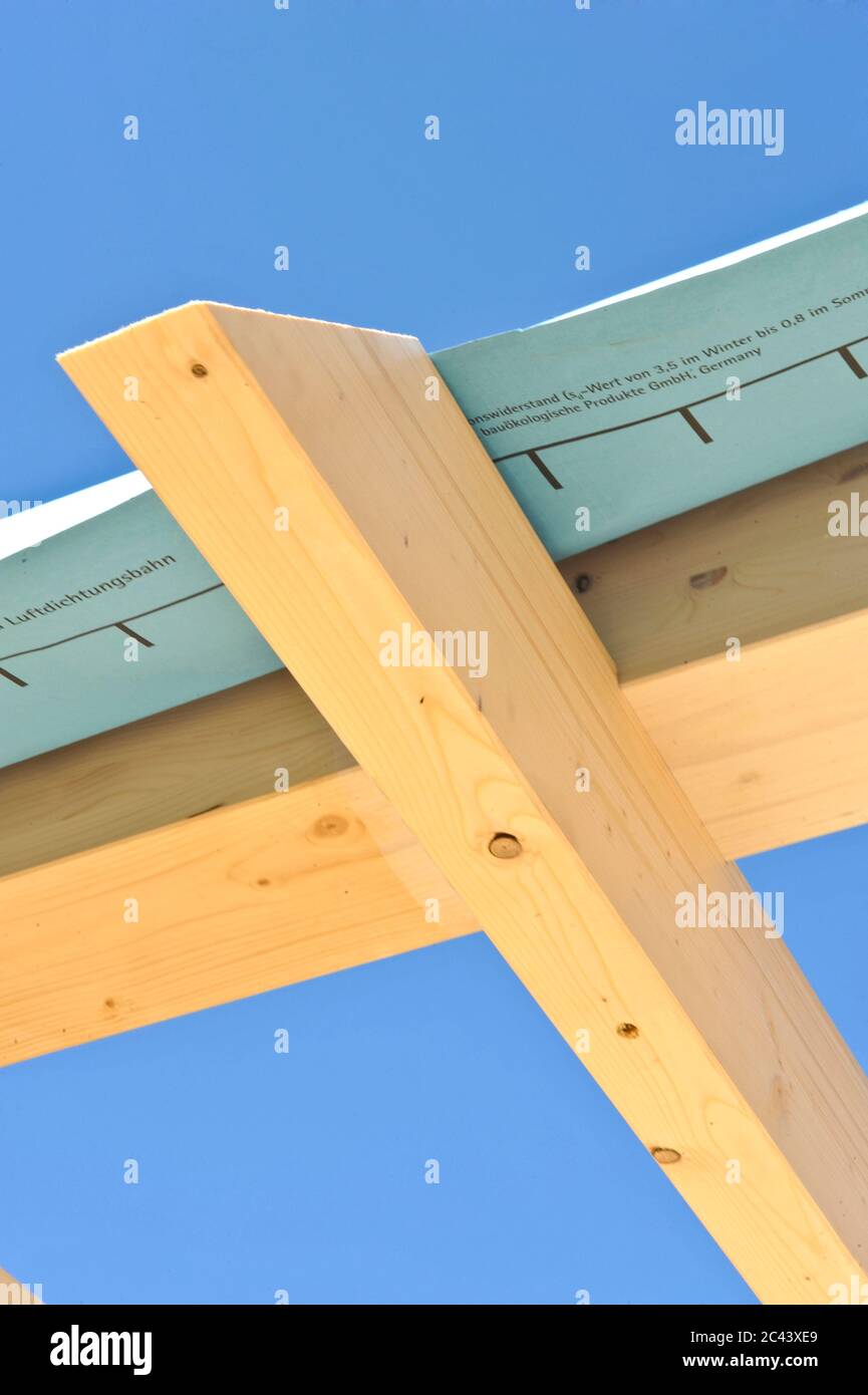 Wooden beams of a roof structure Stock Photo - Alamy