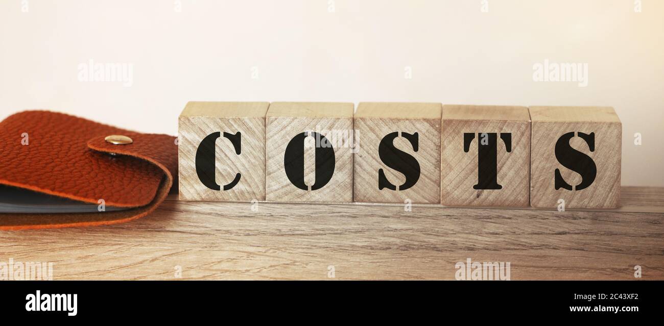 Cost, expense or company profit and loss concept, cube wooden block ...