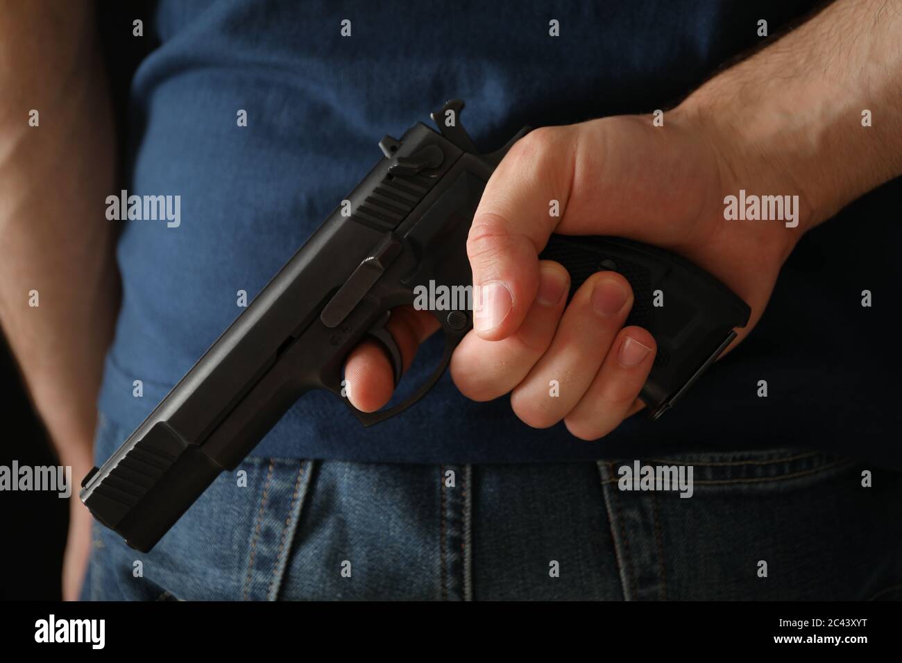 Woman With Weapon Behind Back High Resolution Stock Photography and ...