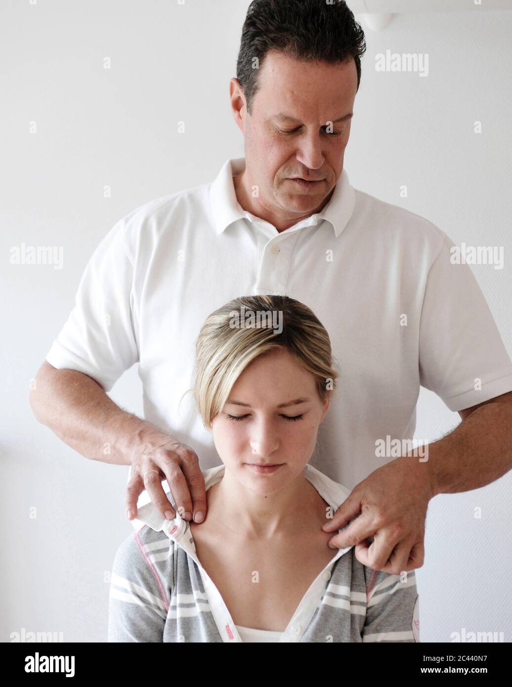 Woman gets a shoulder massage Stock Photo - Alamy