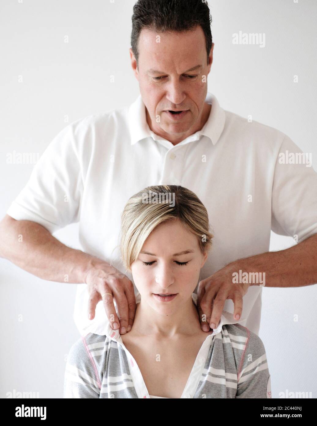 Woman gets a shoulder massage Stock Photo - Alamy
