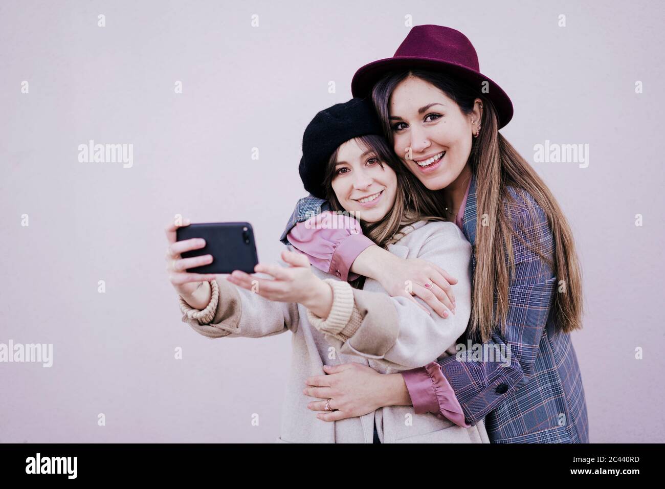 Beautiful women taking selfie smartphone hi-res stock photography and ...