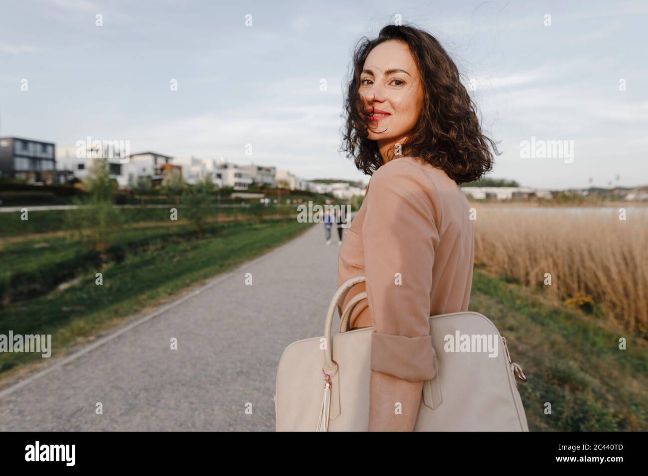 Woman carrying laptop bag hi-res stock photography and images - Alamy