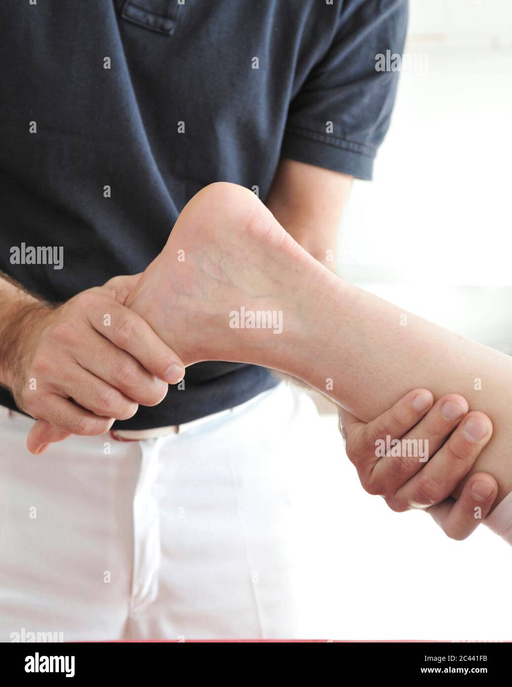 Doctor treats a patient's foot Stock Photo - Alamy