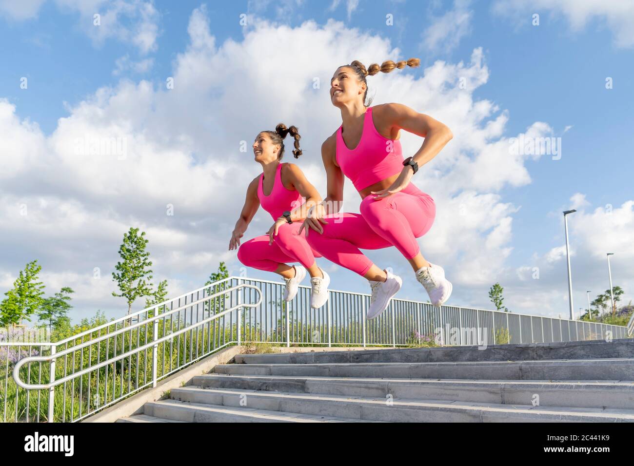 Women jumping hi-res stock photography and images - Alamy