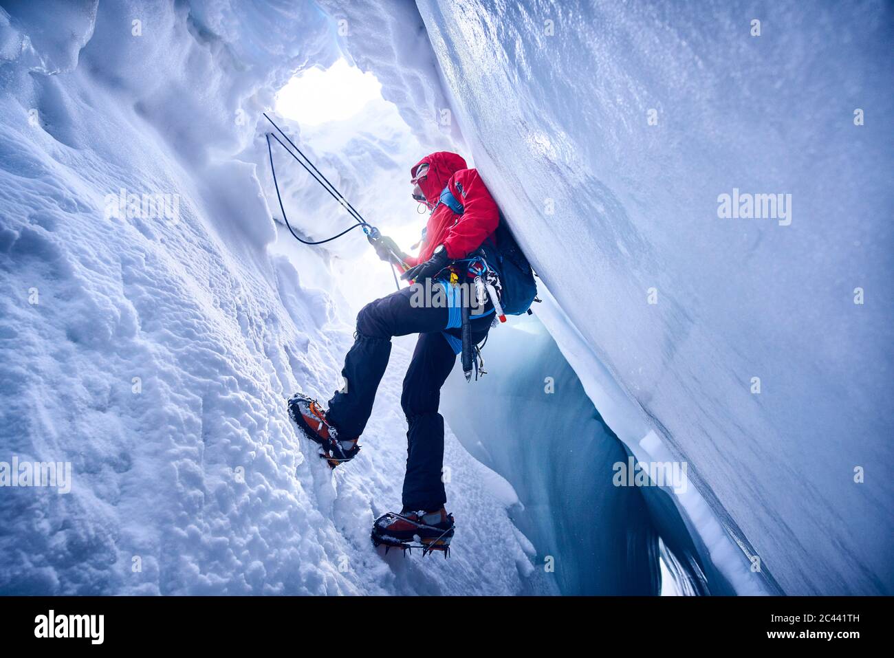 Mountaineer climbing in crevasse, Glacier Grossvendediger, Tyrol ...