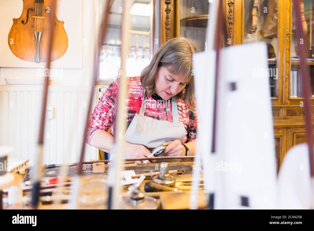 Female violin maker at work Stock Photo - Alamy