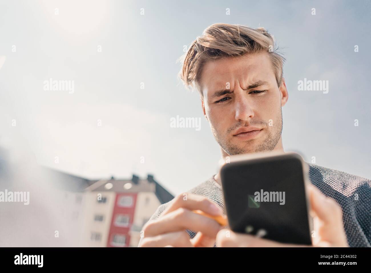 Caucasian man watching smartphone hi-res stock photography and images ...