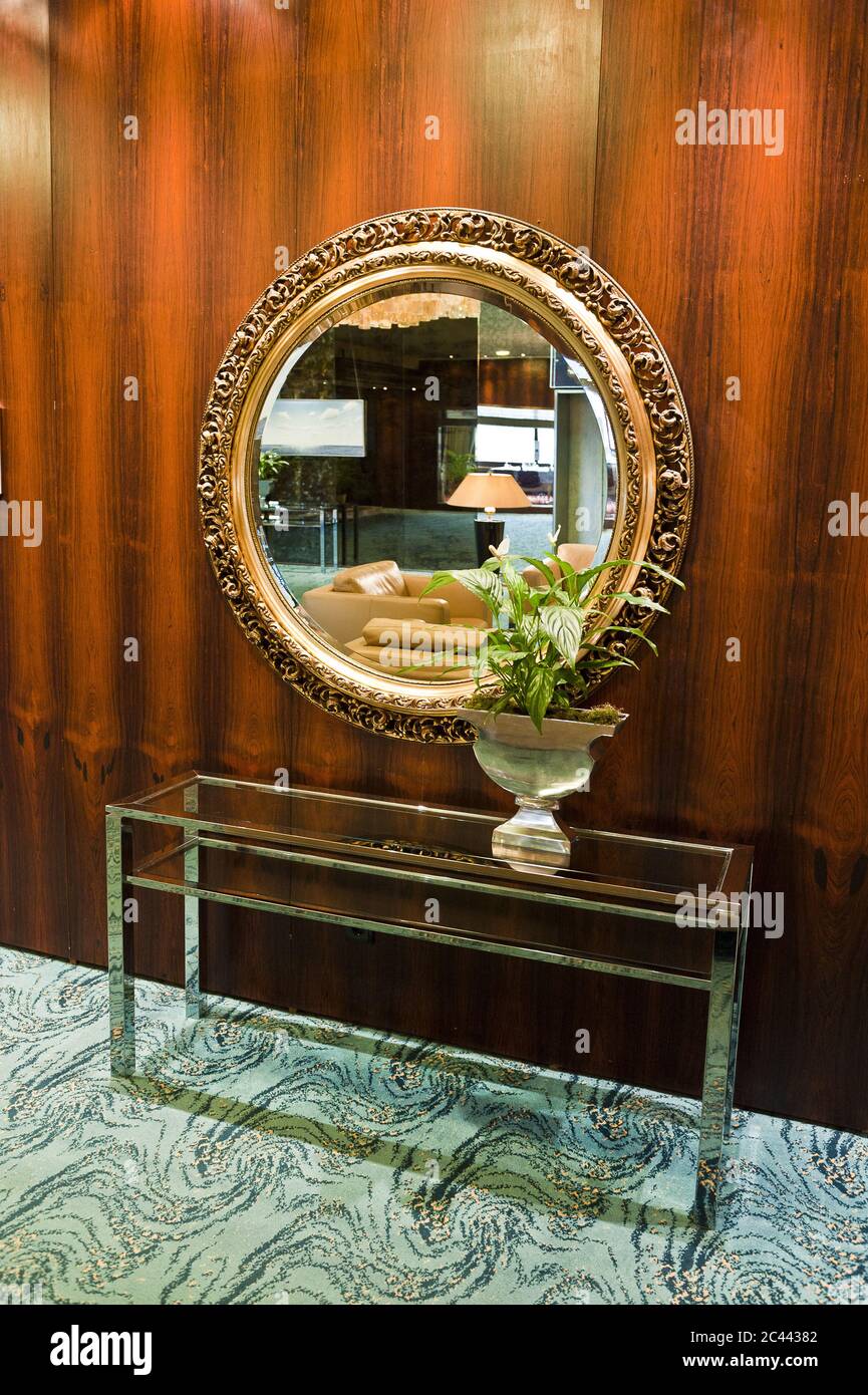 Mirror on a wall in the hotel Stock Photo - Alamy