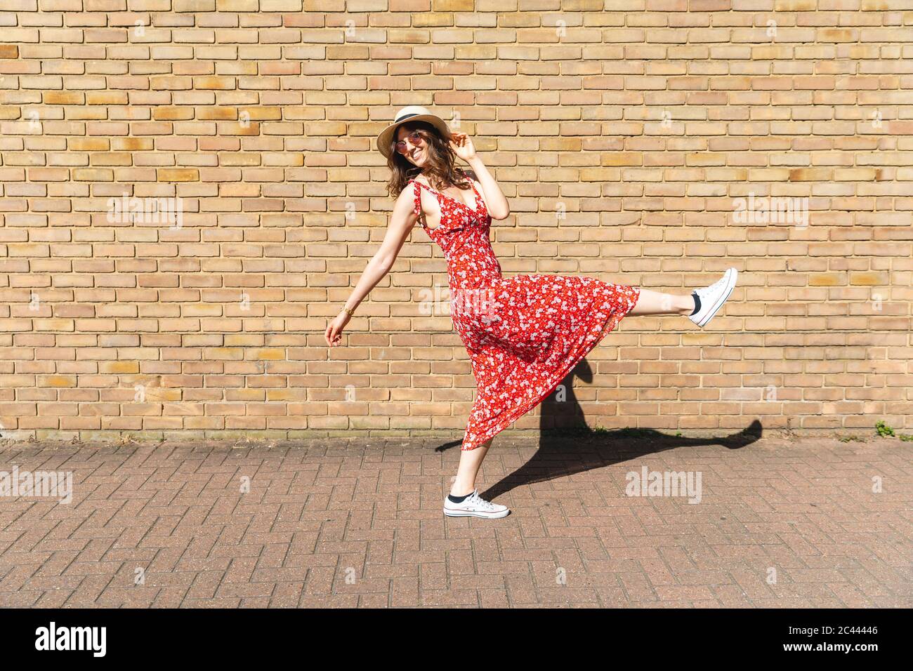 Happy and carefree young woman outdoors Stock Photo - Alamy