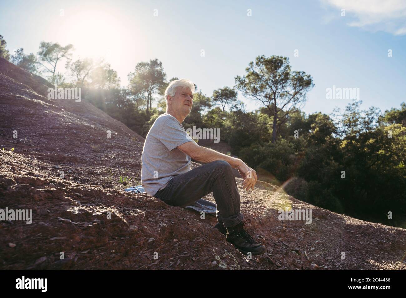 Man sitting on ground hi-res stock photography and images - Alamy