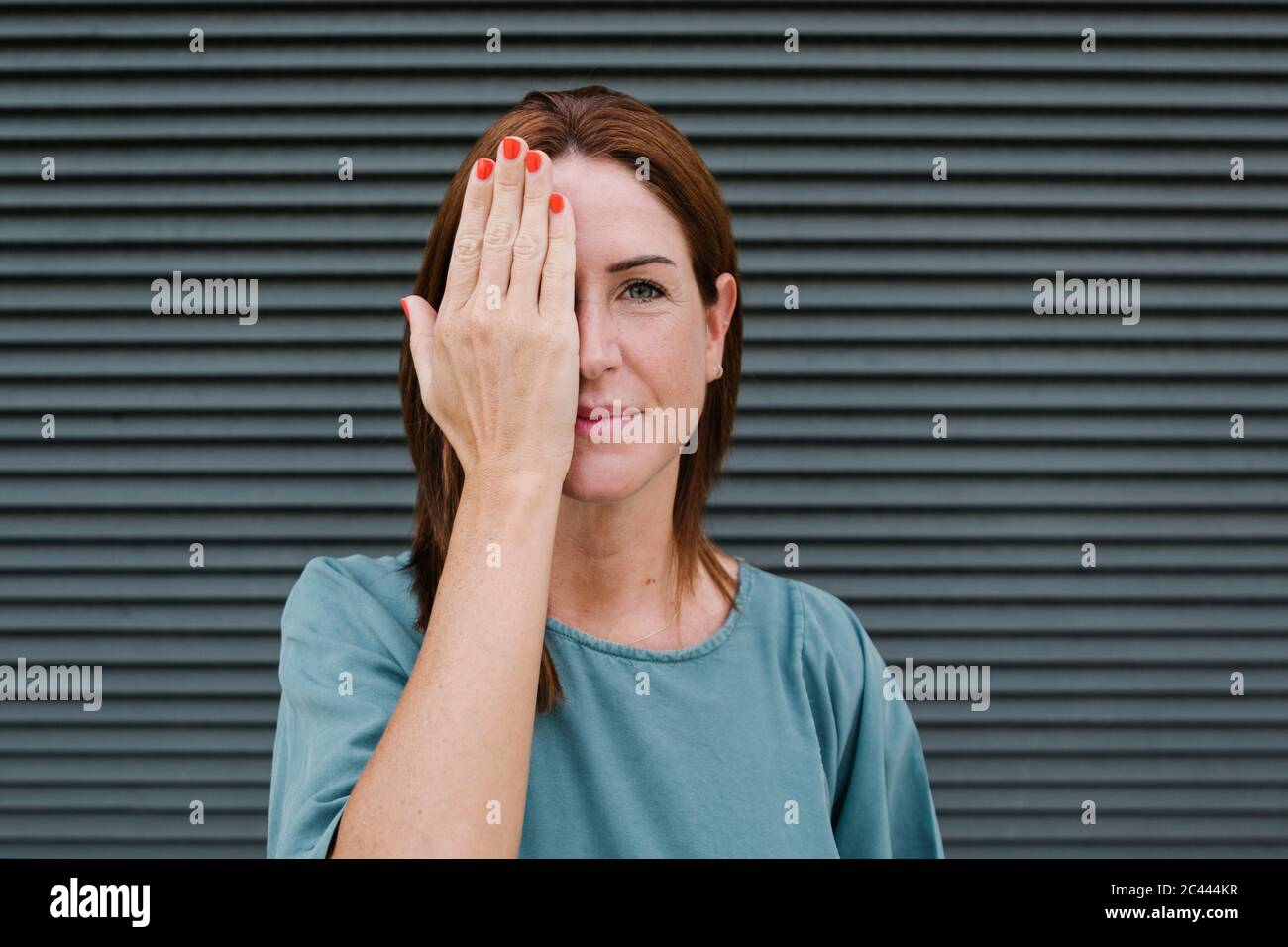 Hand covering eye hi-res stock photography and images - Alamy