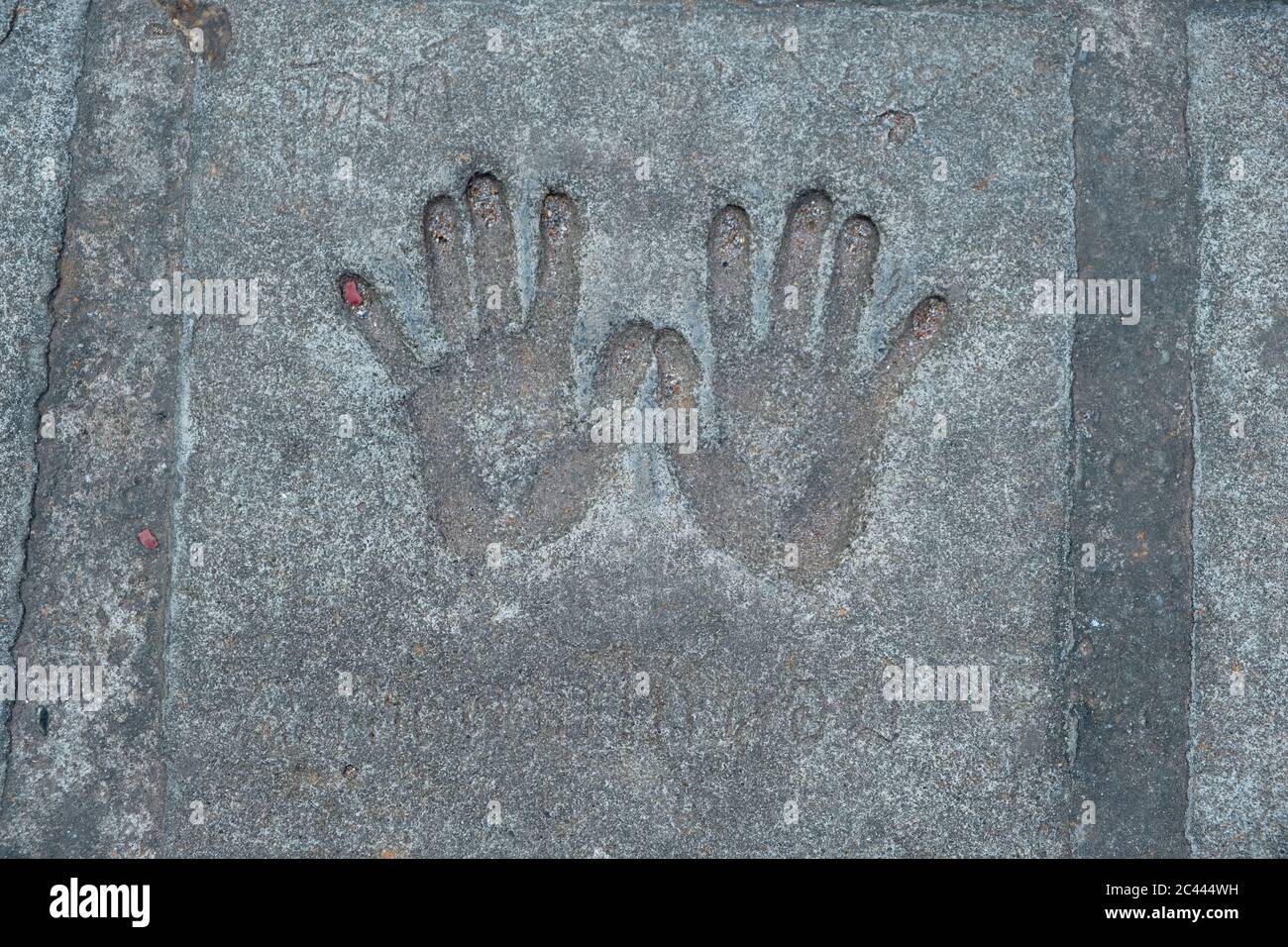 Memorable handprint of a hands in an old concrete wall. The palm is ...